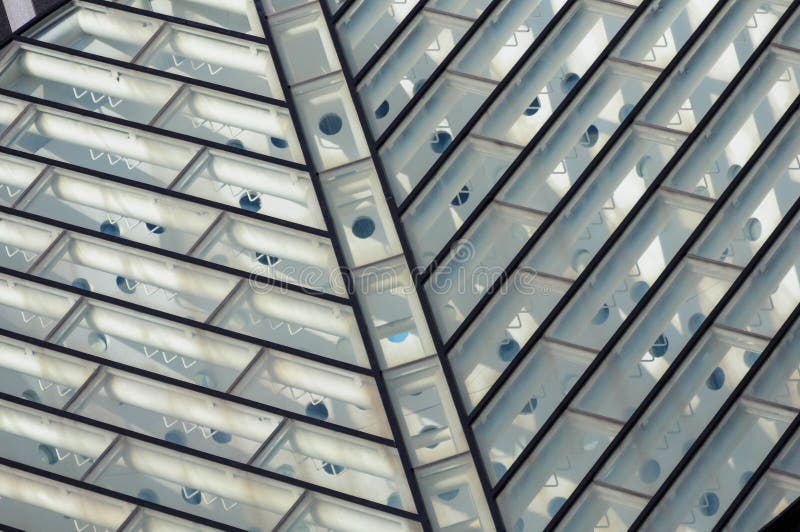 Modern Glass Architecture with Geometric Patterns and Reflections Stock ...