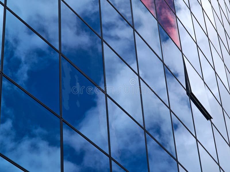 Modern Glass Building with Reflection of Clouds Stock Photo - Image of ...
