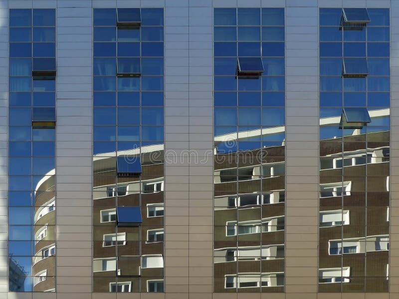 Modern Glass Building with Reflection of Other Building Stock Image ...