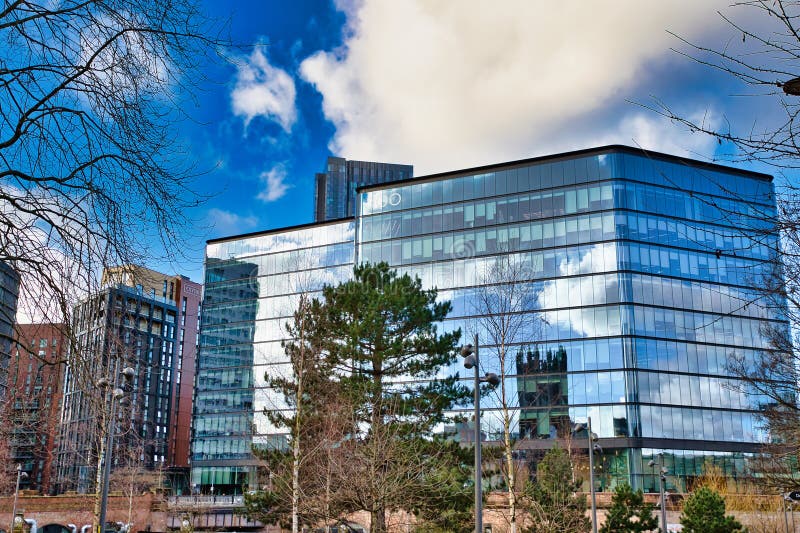 Modern Glass Building Reflection with Surrounding Structures in ...