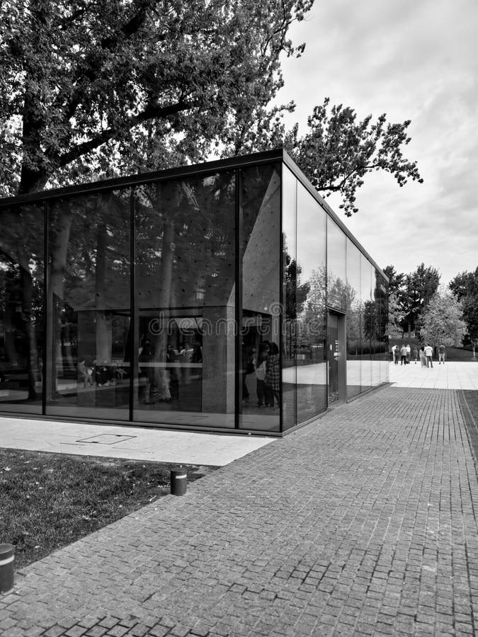Modern Glass Building in Urban Park with Trees Reflecting on Windows ...