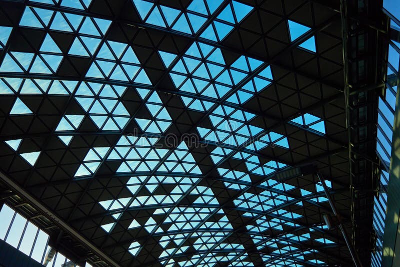 Modern Glass Ceiling with Triangular Pattern Against Blue Sky. Stock ...