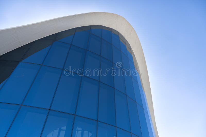 Modern Glass Curved Building Against Deep Blue Sky Stock Photo - Image ...