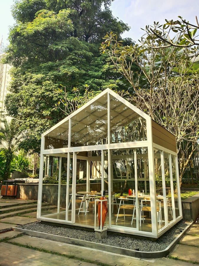 A Modern, Glass-enclosed Structure Rests on a Gravel Base. Stock Image ...