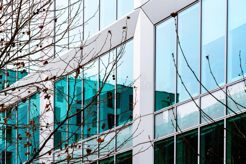 Modern Glass Facade with Reflective Panels and Angular Architectural ...