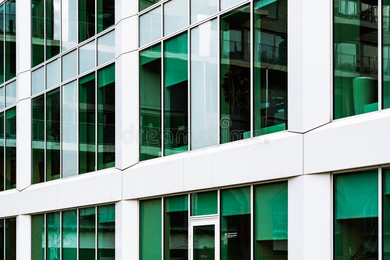 Modern Glass Facade with Reflective Panels and Angular Architectural ...