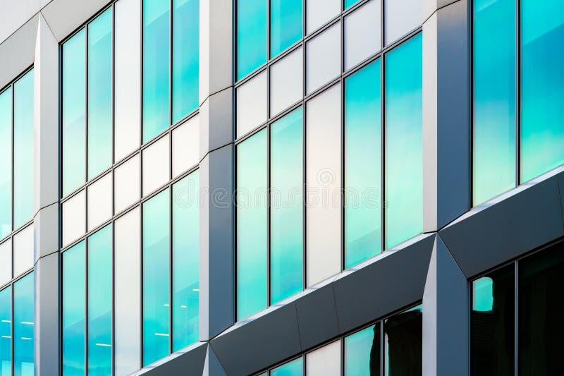 Modern Glass Facade with Reflective Panels and Angular Architectural ...