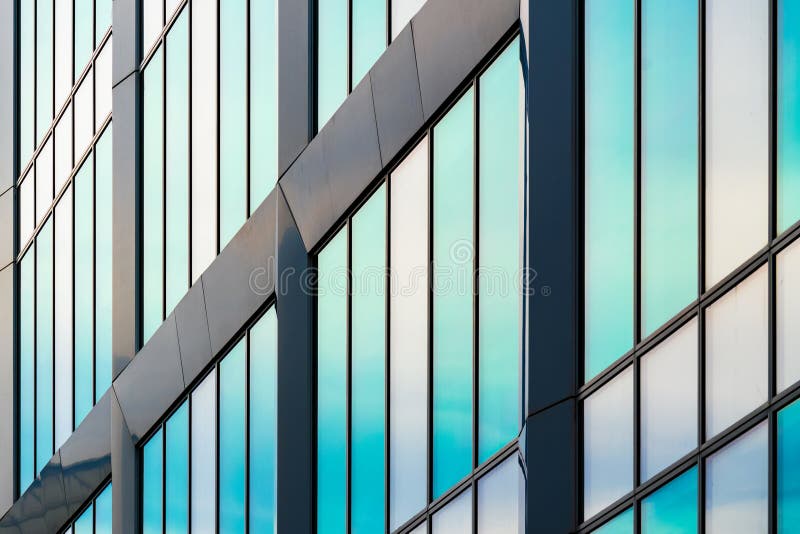 Modern Glass Facade with Reflective Panels and Angular Architectural ...