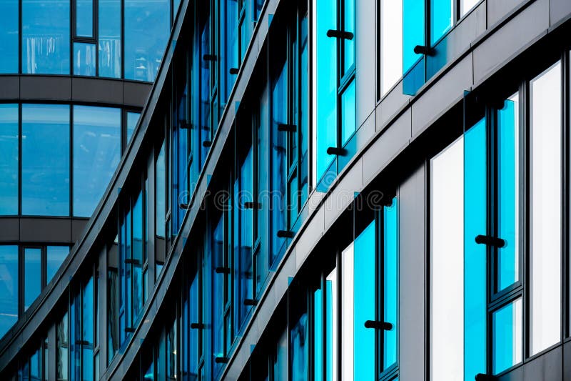 Modern Glass Office Building with Blue-Tinted Windows and Sleek ...