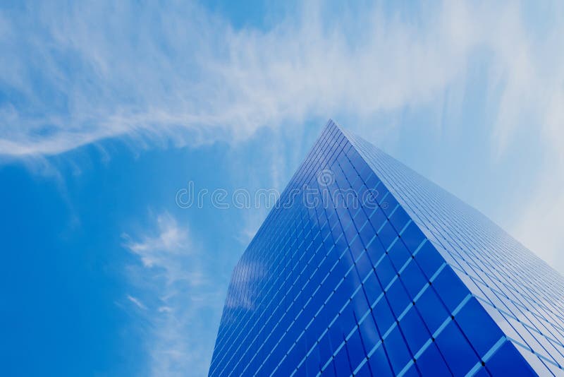 Modern Glass Skyscraper Reflecting Blue Sky and Clouds Stock Photo ...