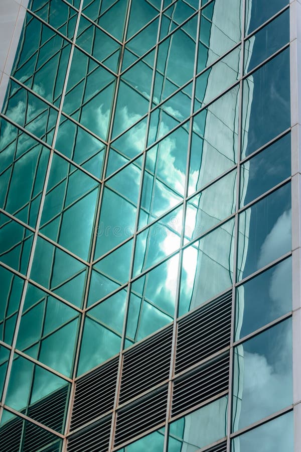 Modern Glass-walled Building with the Reflection of the Sky on the ...