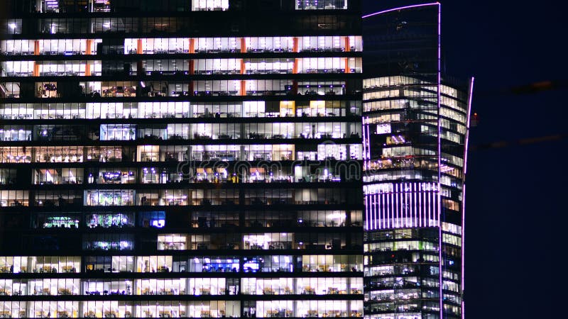Office Building in the Evening with Lightened Workspaces. Stock Photo ...