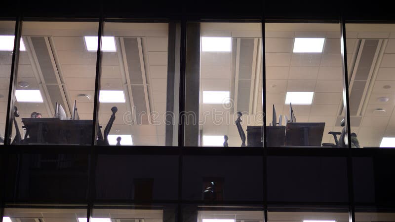 Office Building in the Evening with Lightened Workspaces. Stock Photo ...