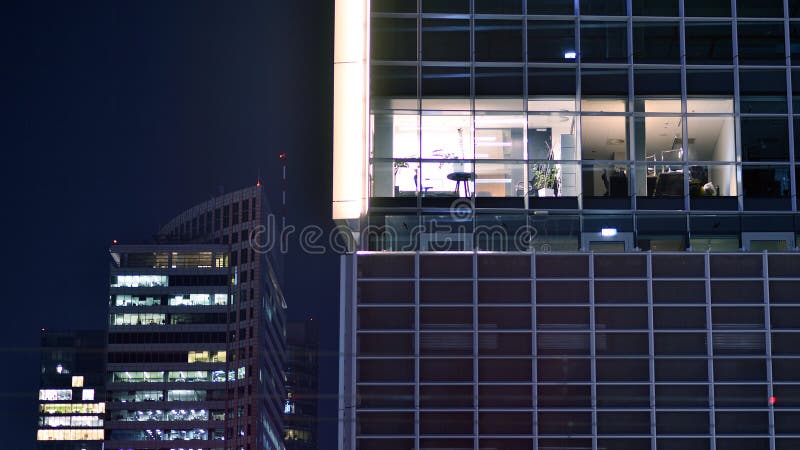 Office Building in the Evening with Lightened Workspaces. Stock Photo ...