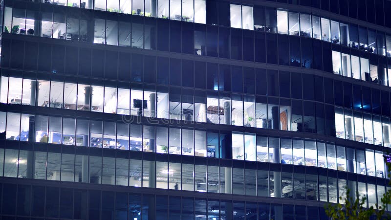 Office Building in the Evening with Lightened Workspaces. Stock Image ...