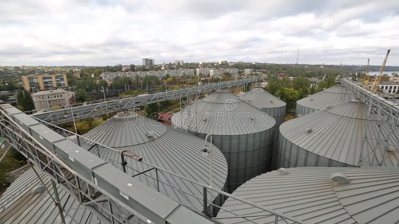 Modern Grain Elevator Terminal in a Sea Port. Metal Tanks and Conveyors ...