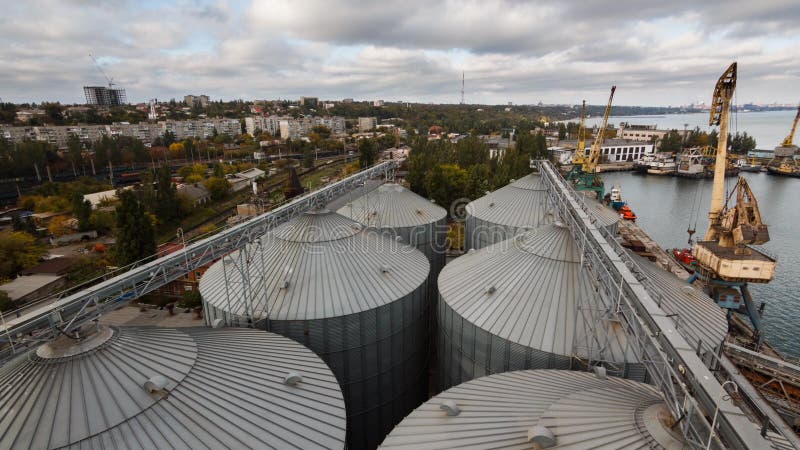 Modern Grain Elevator Terminal in a Sea Port. Metal Tanks and Conveyors ...