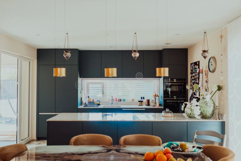Modern White Kitchen with Electronic Devices and Decorative Items Stock ...