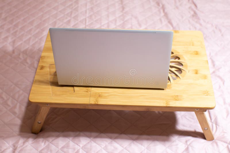 Modern Gray Thin Laptop on the Wooden Cooling Pad for Laptop..Notebook ...