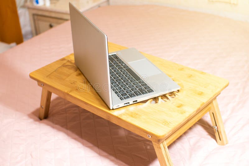 Modern Gray Thin Laptop on the Wooden Cooling Pad for Laptop..Notebook ...