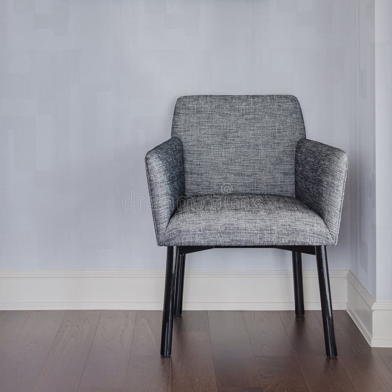 Modern Grey Chair with Blue Wall and Wood Floor Stock Photo - Image of ...