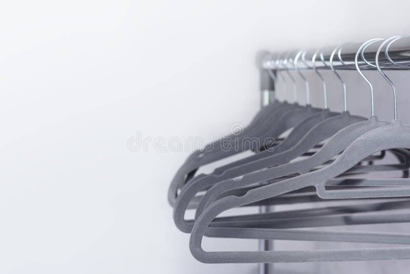 Modern Grey Empty Hangers on Neutral Wall Background Stock Photo ...