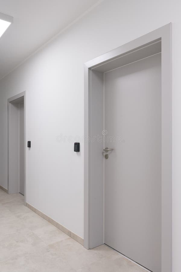 Modern Hallway with Doors and Security Keypads Stock Image - Image of ...