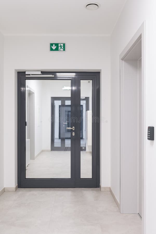 Modern Hallway with Emergency Exit Door and Access Control Stock Photo ...
