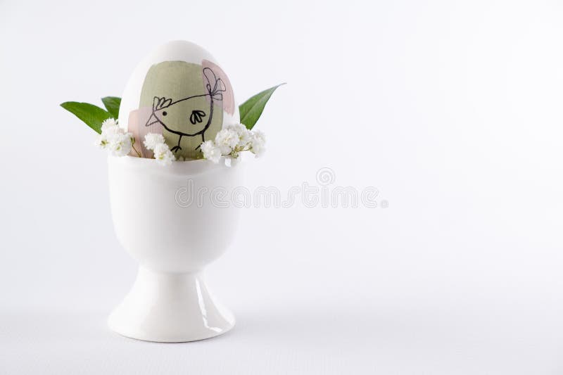 Modern Hand Painted Easter Egg in Egg Stand with Flovers. Minimal ...