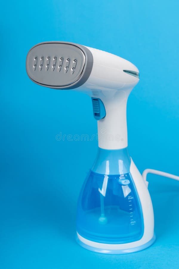 Modern Handheld Steamer for Clothes on Blue Background Stock Image ...