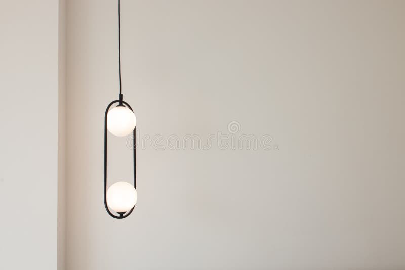 Modern Hanging Lights Over the White Wall. Minimalist Design Stock ...
