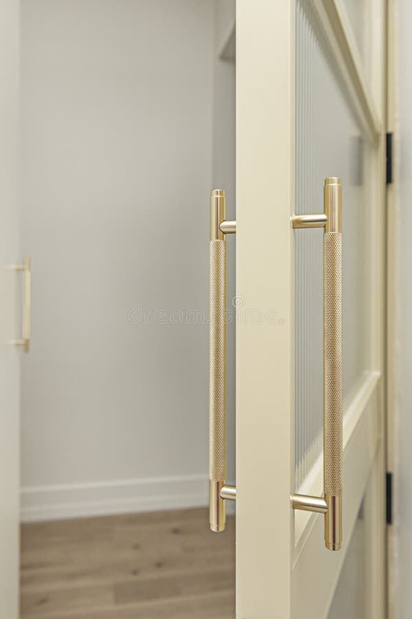Modern Hardware Detail: Straight Chrome Handle Installed Vertically on White Door Stock Image ...