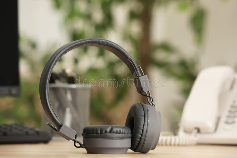 Modern Headphones, Desktop Telephone and Computer on Table Indoors ...