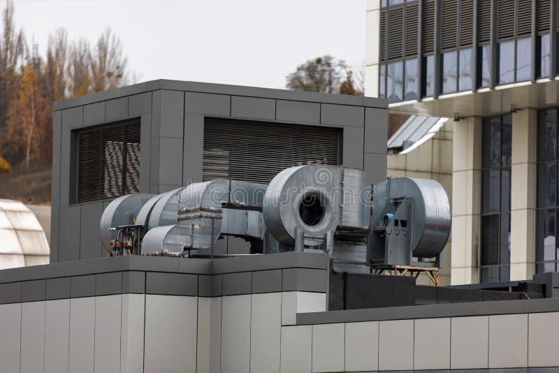 Modern High Capacity Industrial Ventilation Fans on Roof of Building ... Modern High Capacity Industrial Ventilation Fans on Roof of Building ...