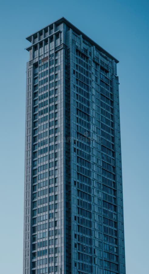Modern High-rise Building Against Clear Blue Sky Capturing Urban ...