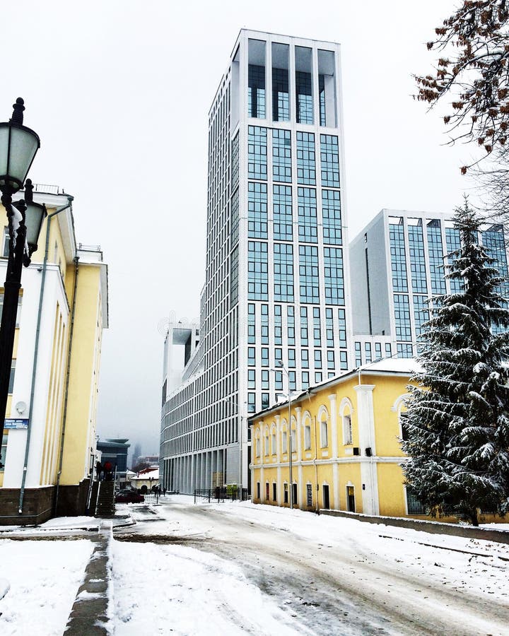 Modern High-rise Building on Background of Historic Old Buildings ...