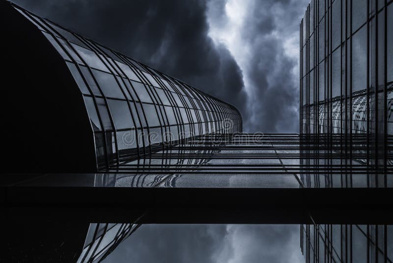 Modern High Rise Building Under Rain Cloud Sky Stock Photo - Image of ...