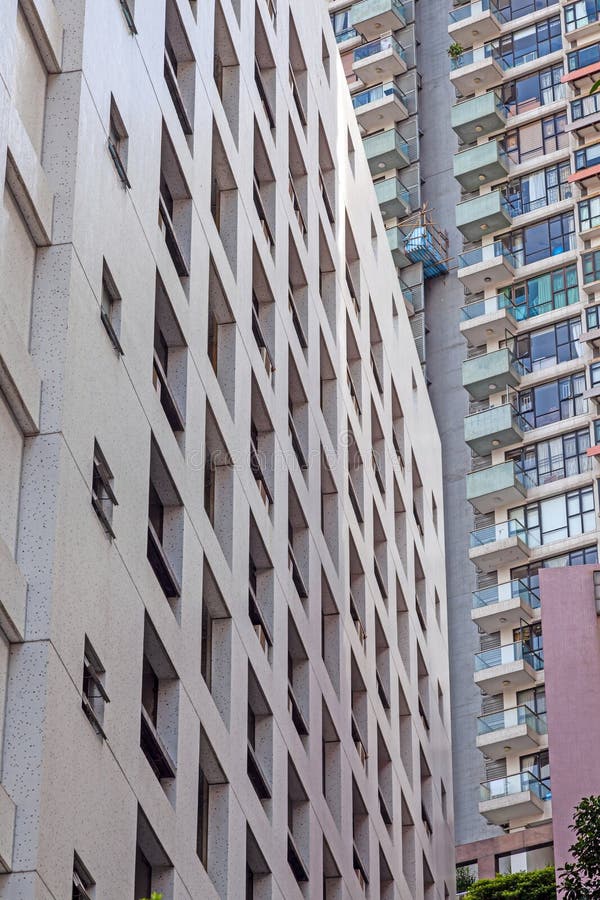 Modern High-rise Facade with Repeating Geometric Balconies Creating a ...