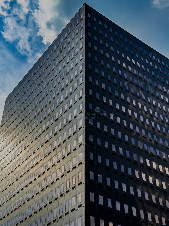 Modern High-rise Office Building with Reflective Windows Against a ...