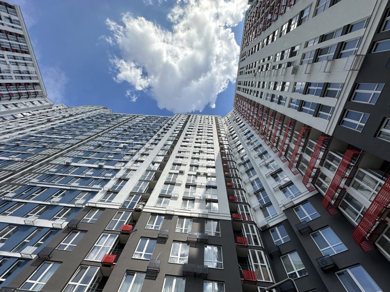 A Modern High Rise Residential Complex with Many Windows, a Skyscraper ...