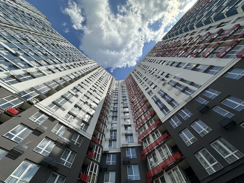 A Modern High Rise Residential Complex with Many Windows, a Skyscraper ...
