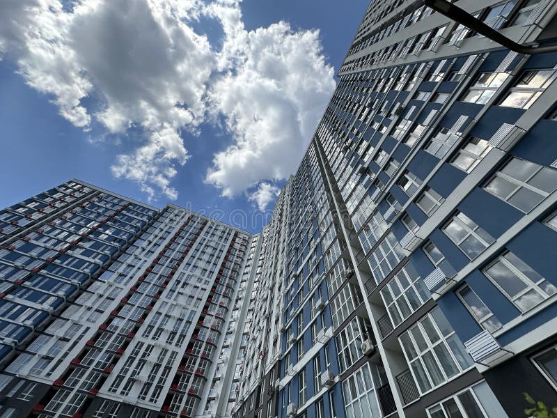 A Modern High Rise Residential Complex with Many Windows, a Skyscraper ...