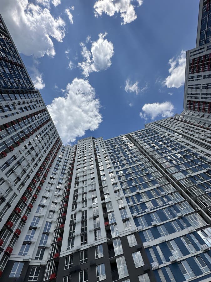 A Modern High Rise Residential Complex with Many Windows, a Skyscraper ...