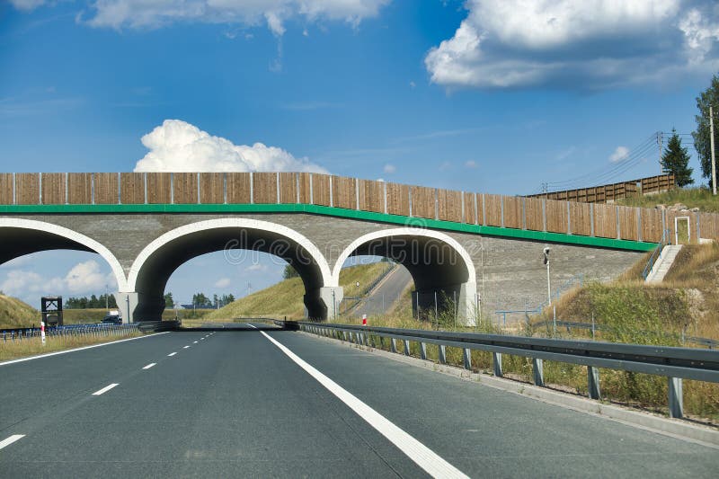 Modern Highway with an Overpass Bridge on a Sunny Day with Blue Skies ...