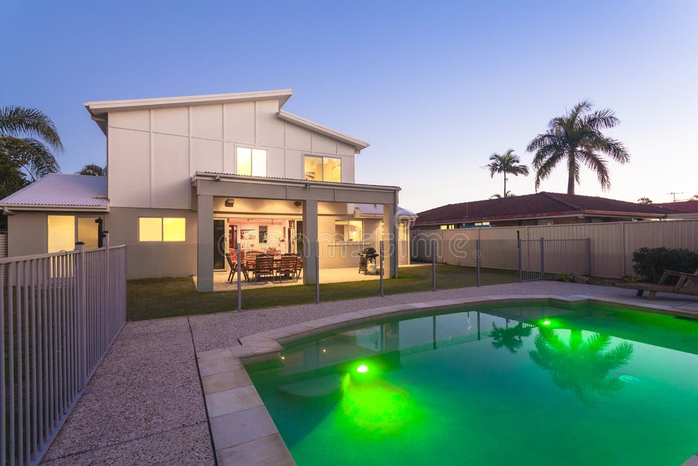 Modern Home Exterior at Dusk Stock Image - Image of pool, property ...