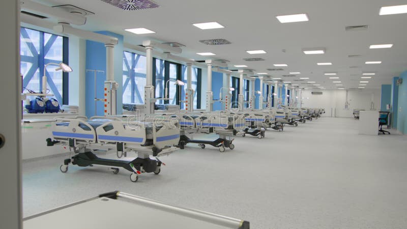 Modern Hospital Room with Multiple Empty Beds Equipped with Advanced ...
