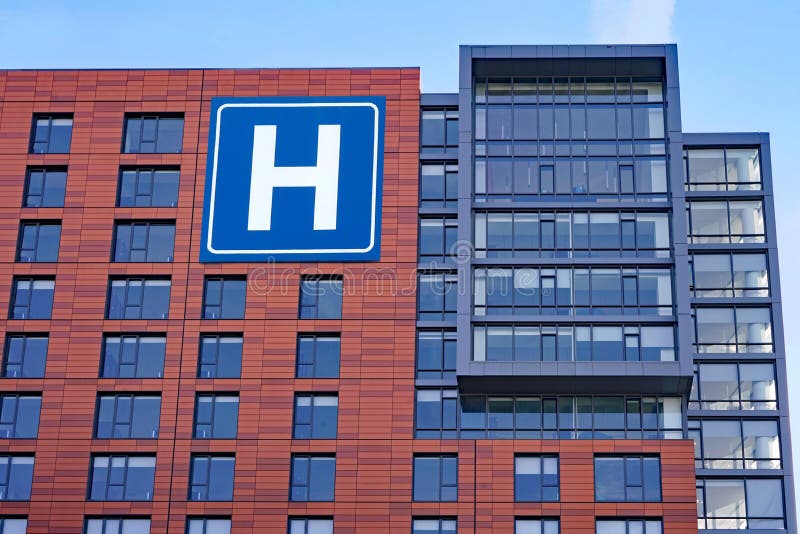 Building with Large H Sign for Hospital Stock Photo - Image of letter ...
