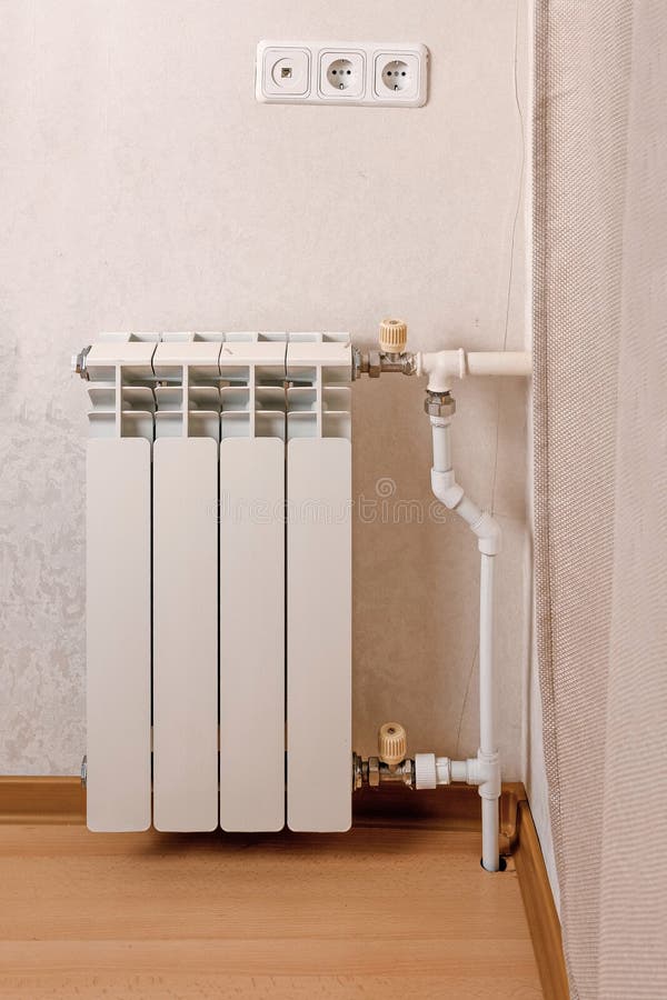 Modern Hot Water Radiator on the Wall Stock Photo - Image of heather ...