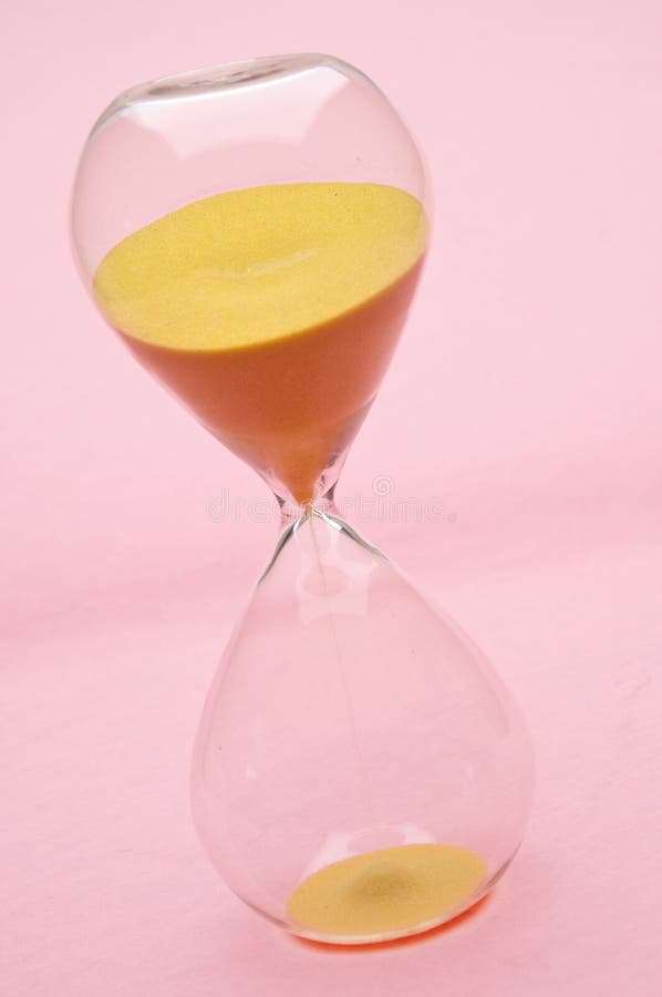 Modern Hour Glass on Pink stock photo. Image of falling - 14310096