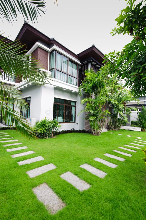 Modern house in the garden stock photo. Image of grass - 40351116